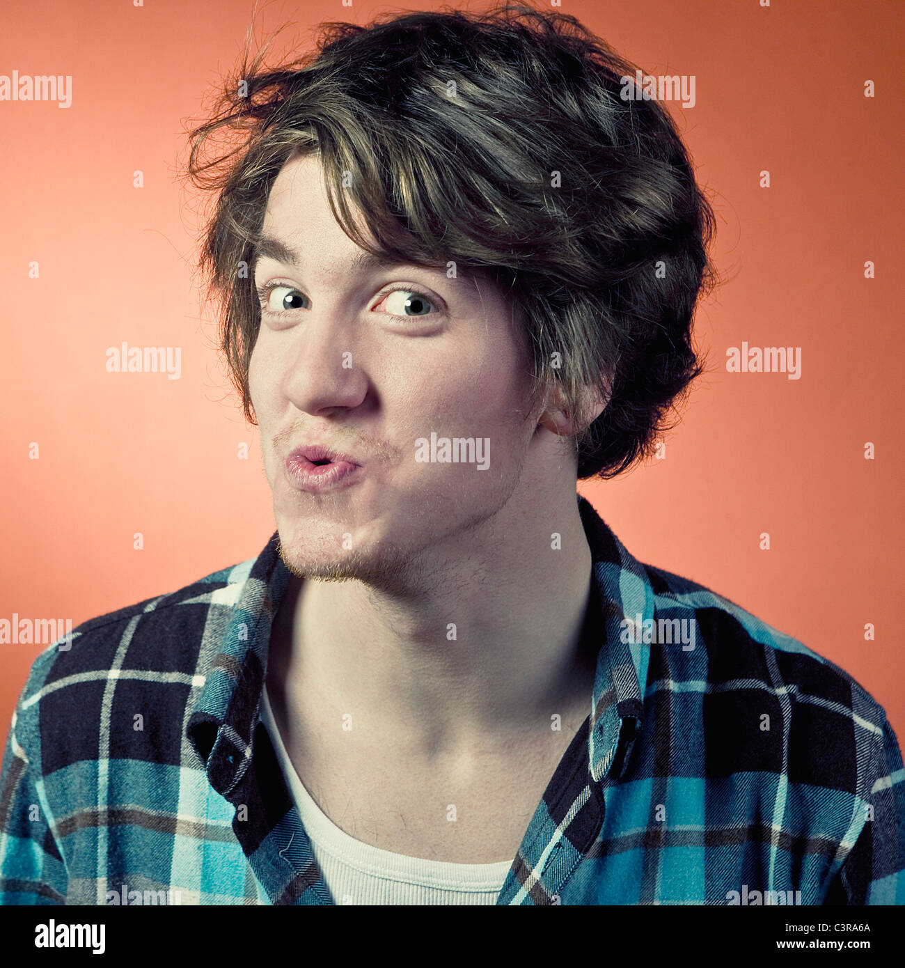 Man making funny faces and pouting, portrait Stock Photo - Alamy