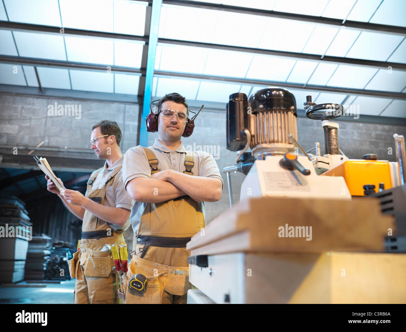 Two men working wood machinery hi-res stock photography and images - Alamy