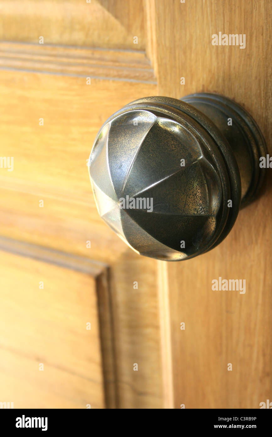 Wooden door metallic handle Stock Photo - Alamy