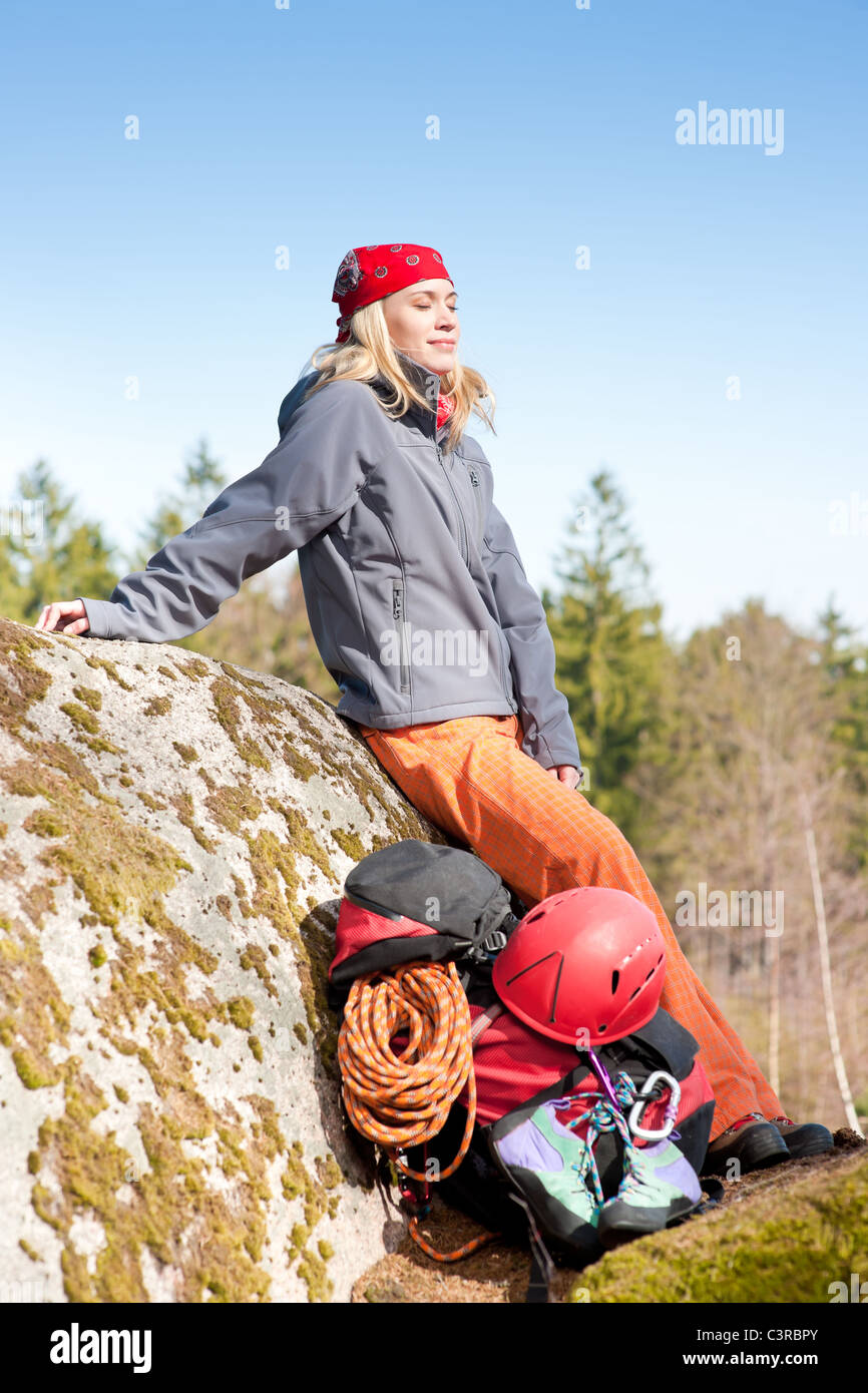 Active young woman rock climbing relax with backpack on mountain Stock ...