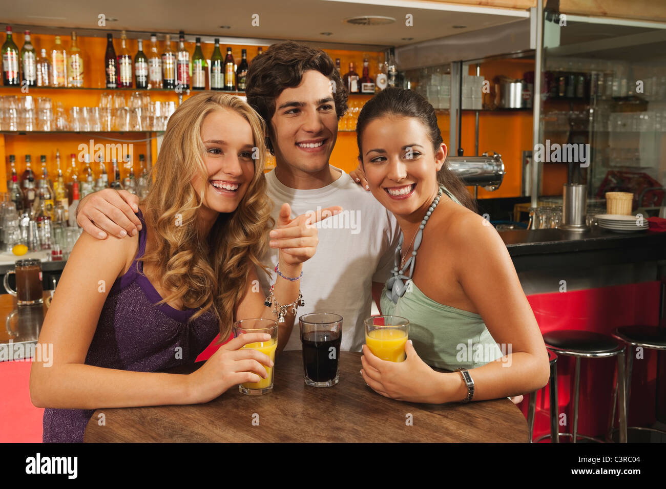 Germany, Munich, Friends together in cafe, smiling Stock Photo - Alamy