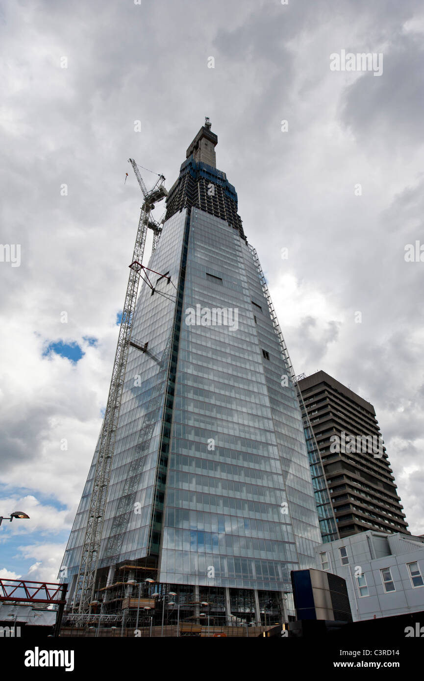 The Shard, sky scraper towers over London Bridge and is now well on its ...
