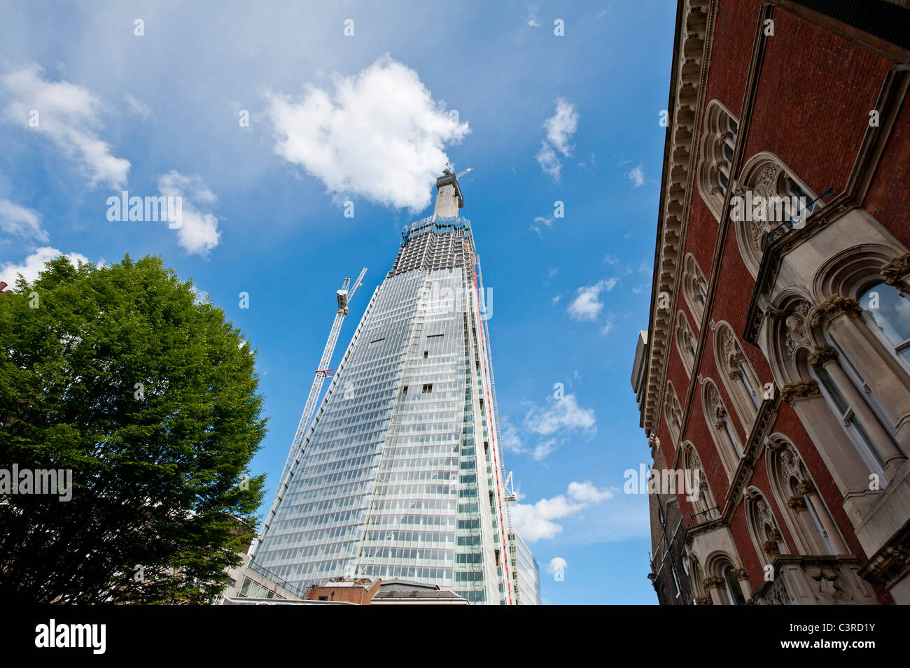 The Shard, sky scraper towers over London Bridge and is now well on its ...