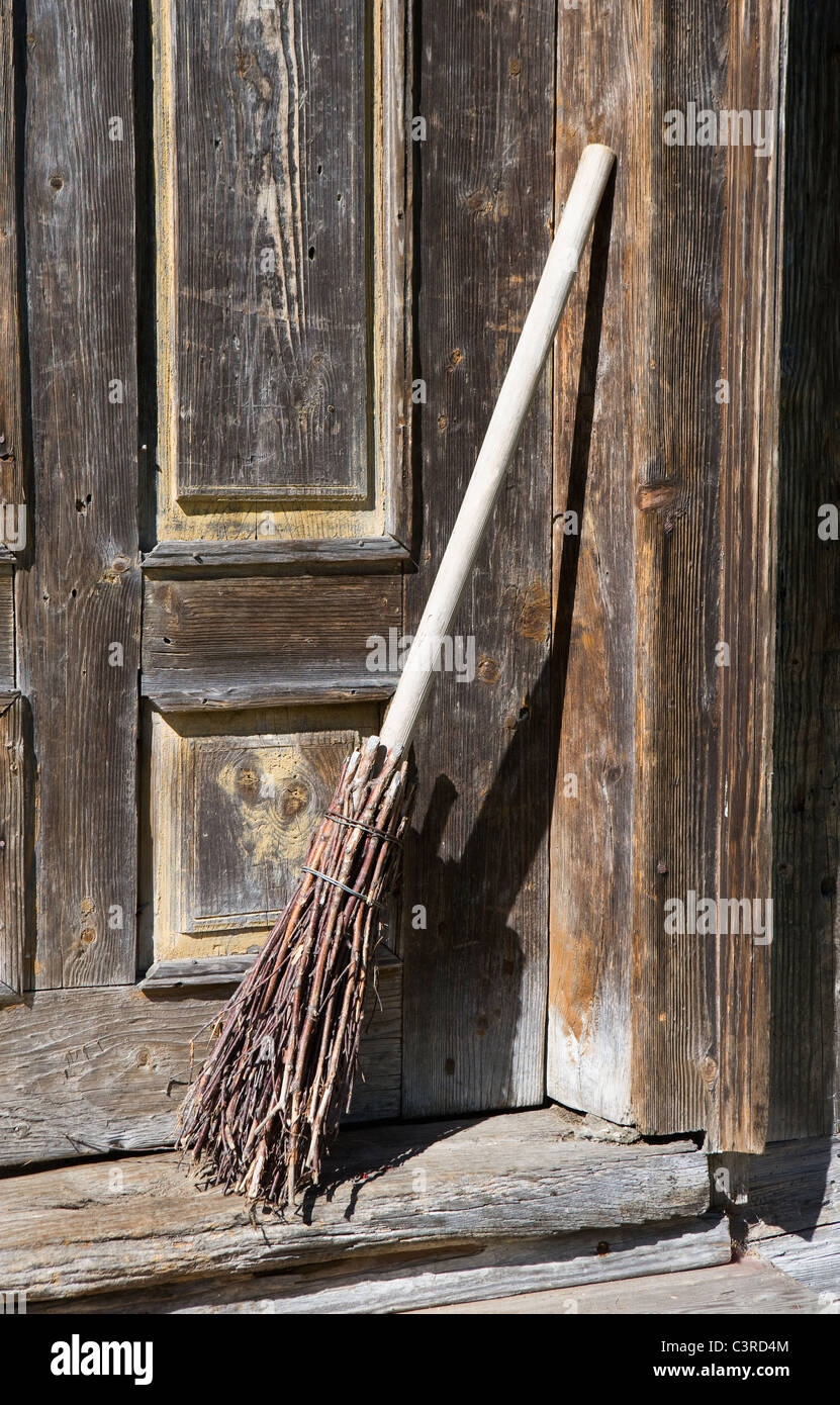 Austria, Land Salzburg, Broom kept at door of farmhouse Stock Photo - Alamy