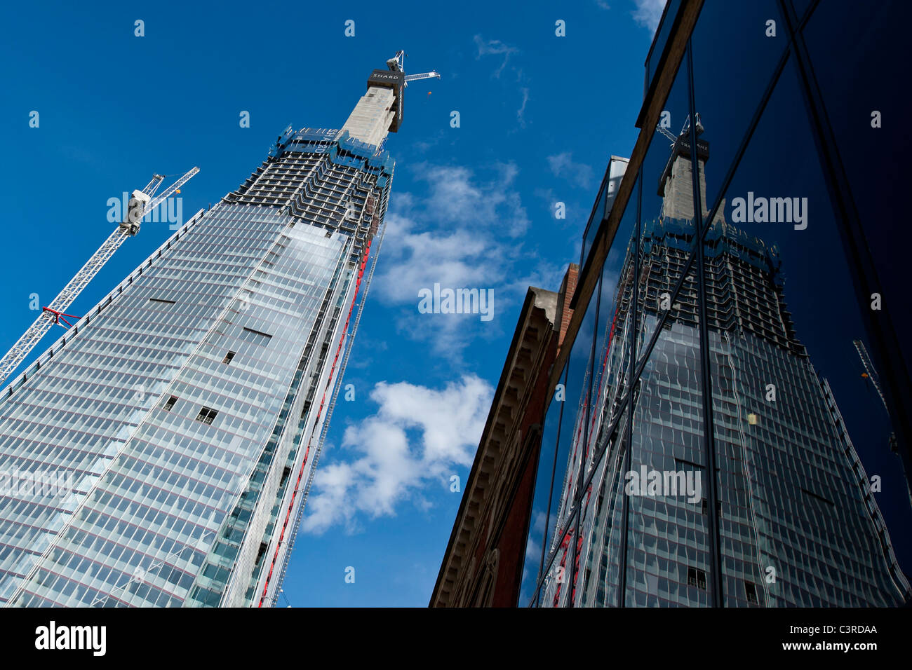 The Shard, sky scraper towers over London Bridge and is now well on its ...