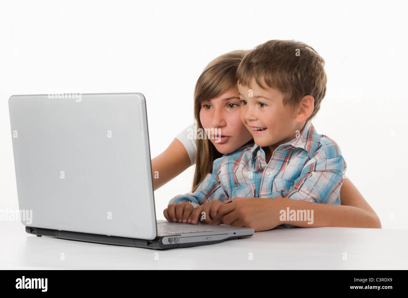 Girl and boy (2-5) using laptop, smiling Stock Photo - Alamy