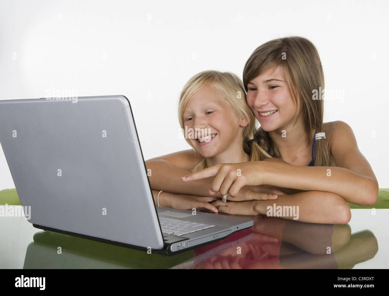 Two girls (10-11) using laptop, smiling Stock Photo - Alamy Two girls (10-11) using laptop, smiling Stock Photo - Alamy