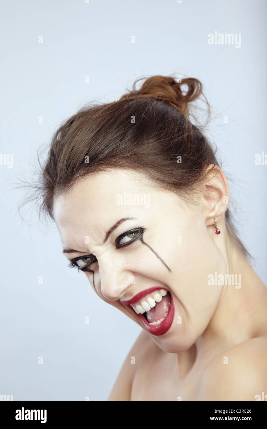 Crying woman with flowing make-up Stock Photo - Alamy