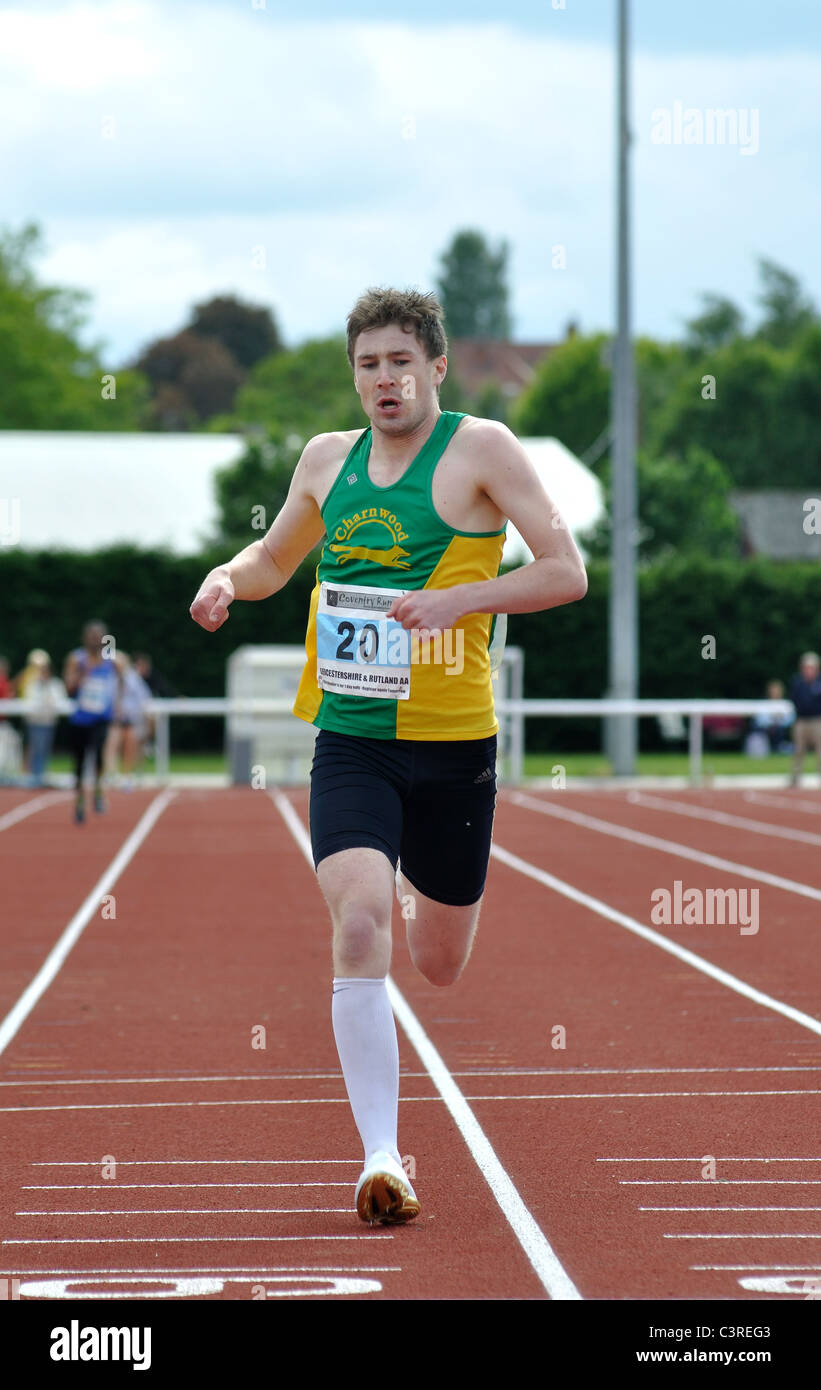 Runner finishing in men`s 400m race Stock Photo - Alamy