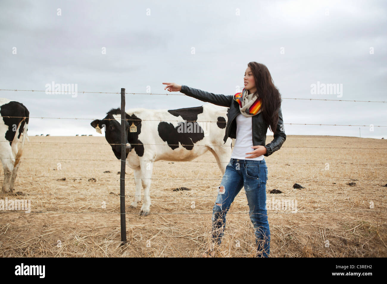 Girl showing direction Stock Photo - Alamy
