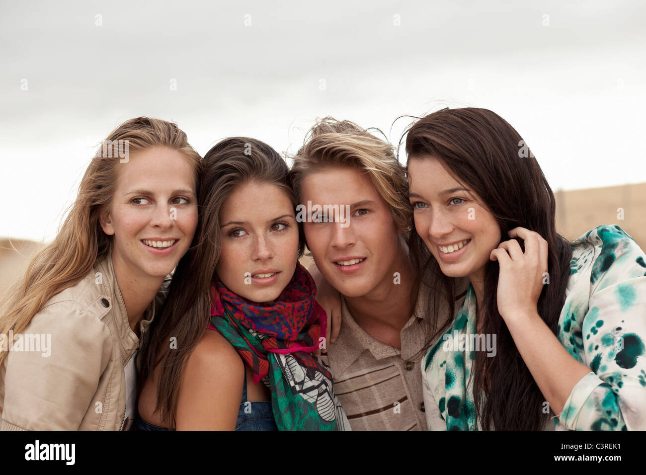 Four Friends smiling Stock Photo - Alamy