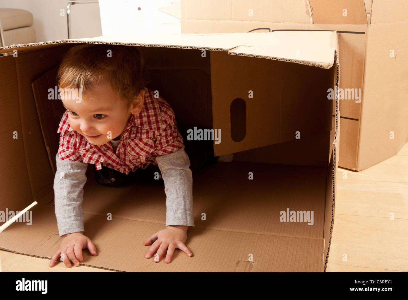 Little boy in packing case Stock Photo - Alamy