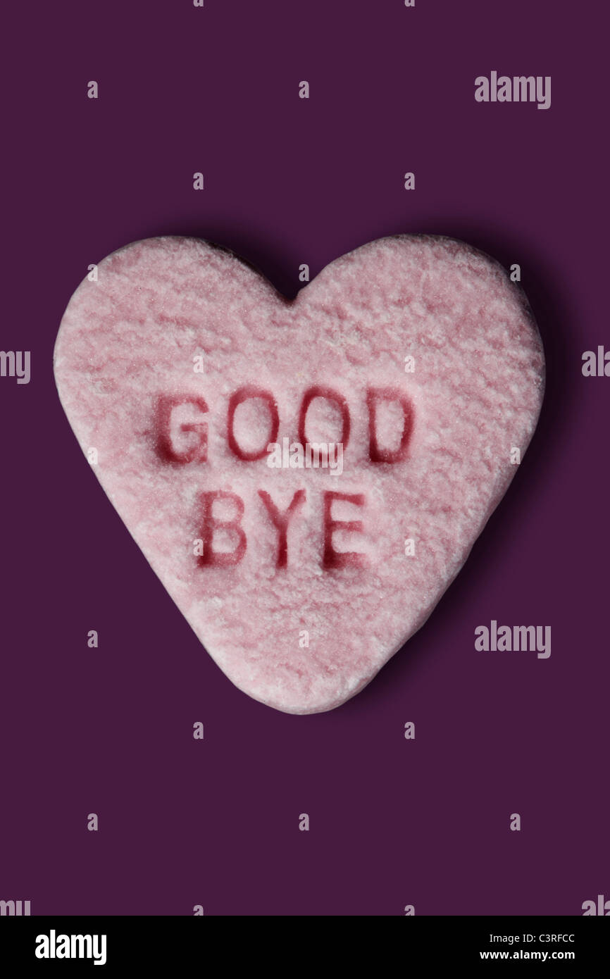 Heart shaped sweets with text against purple background Stock Photo - Alamy