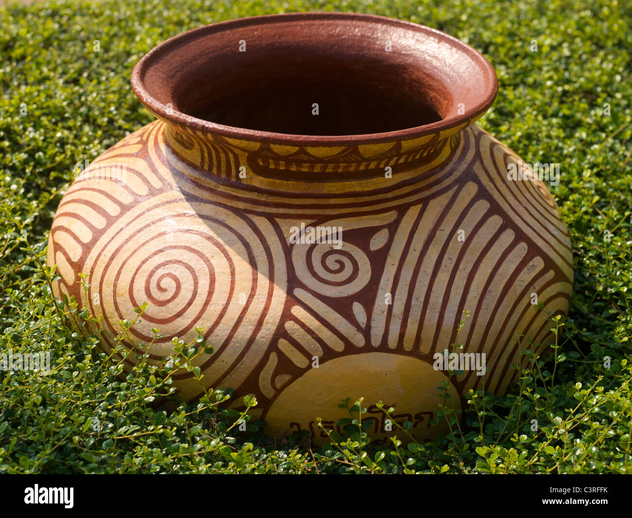 Ban Chiang pot in hedge Stock Photo - Alamy
