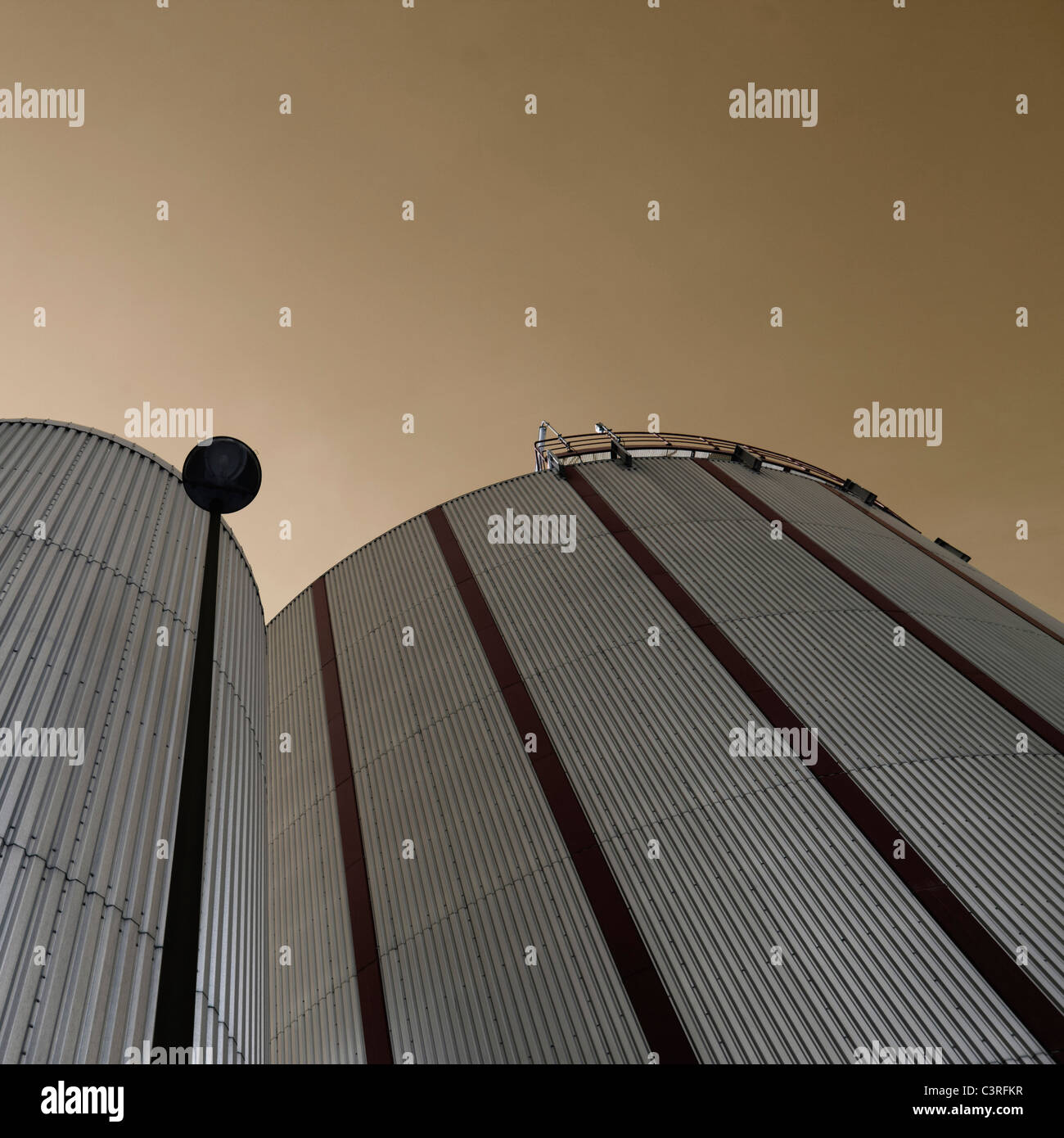 Germany, Offenbach, Storage tanks for oil at dusk Stock Photo - Alamy