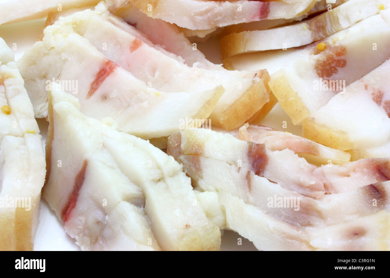 The cut fresh fat with layers lies on a white background Stock Photo ...