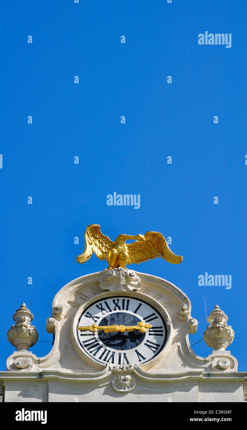 golden eagle sculpture atop a baroque watch, castle schönbrunn, vienna ...