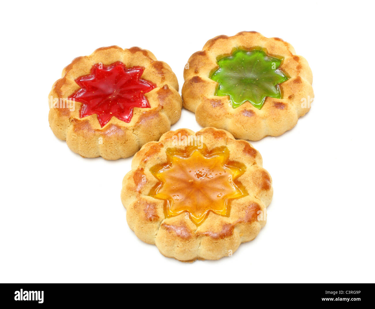 Cookies of yellow color with a stuffing from multi-colored jelly in the ...