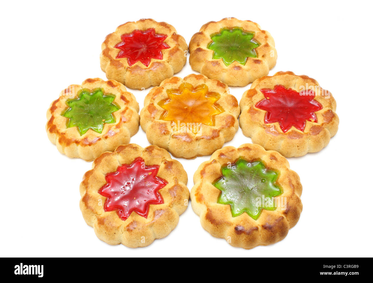 Cookies of yellow color with a stuffing from multi-colored jelly in the ...