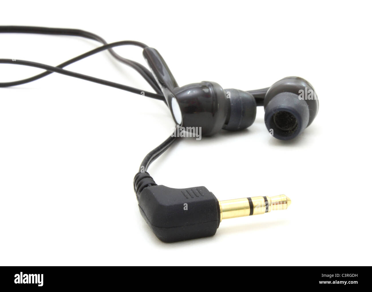 Small ear-phones and the tip for connection on a white background Stock ...