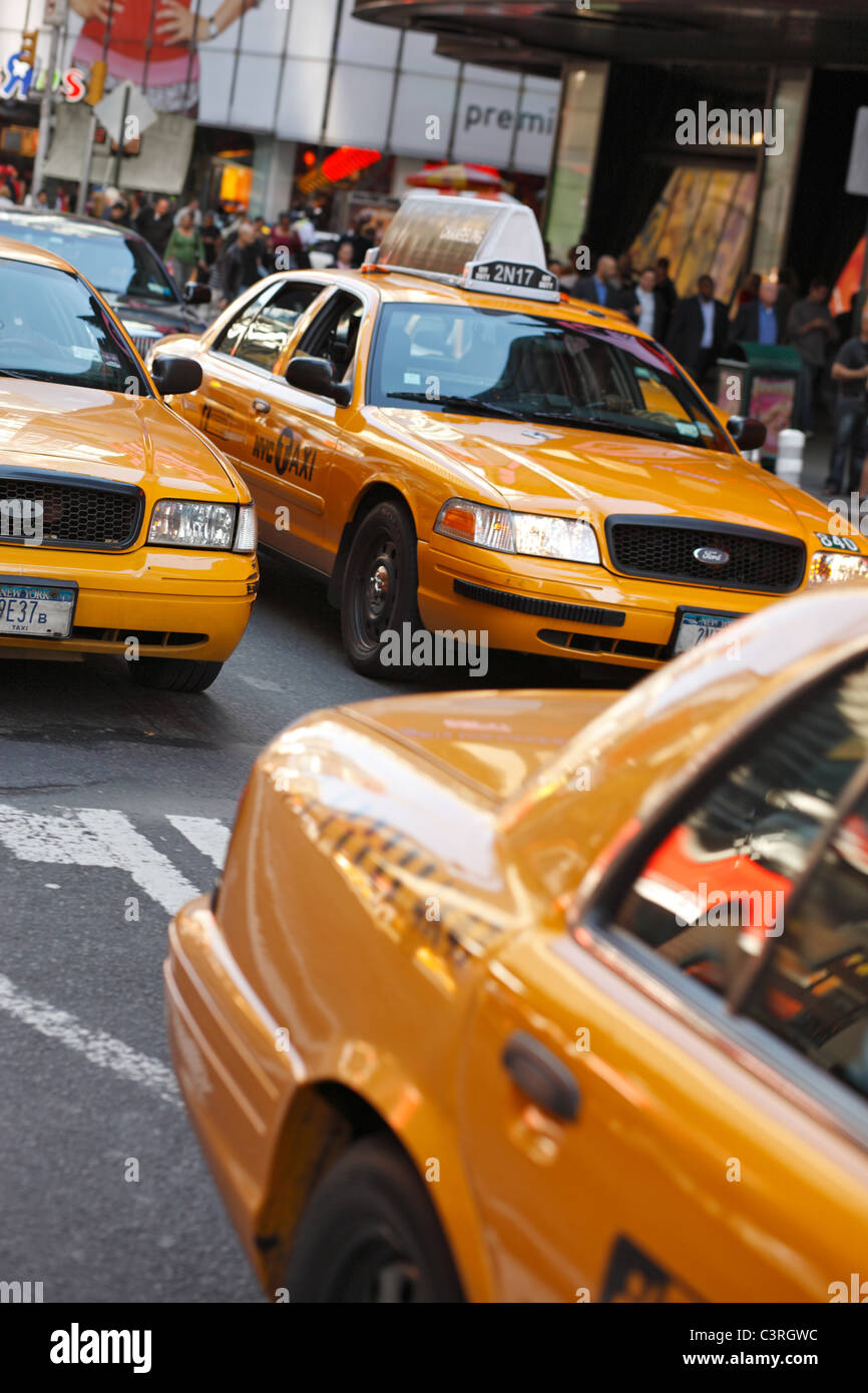 Yellow cabs in Times Square, New York City, USA Stock Photo - Alamy