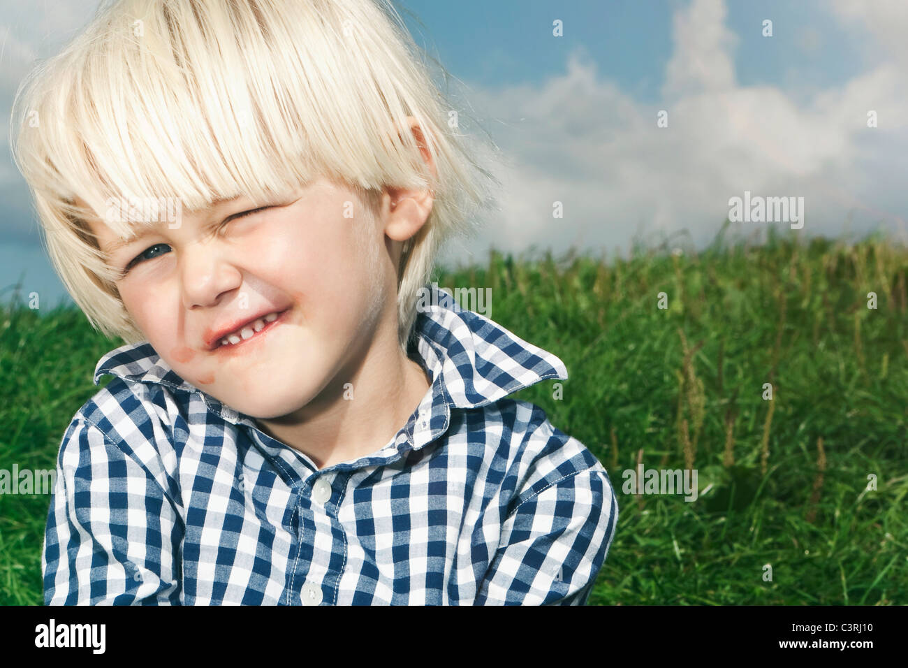 Boy biting lip hi-res stock photography and images - Alamy