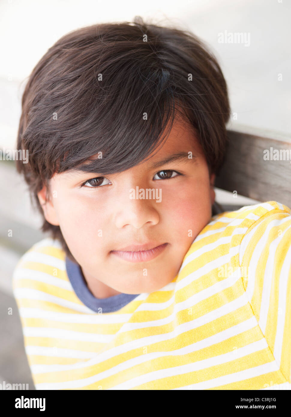 Serious Hispanic boy Stock Photo - Alamy