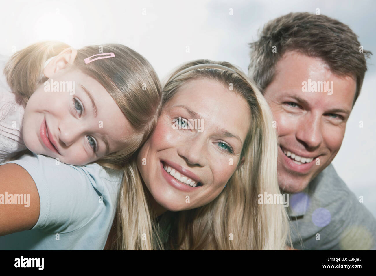 Germany, Cologne, Family smiling, portrait Stock Photo - Alamy