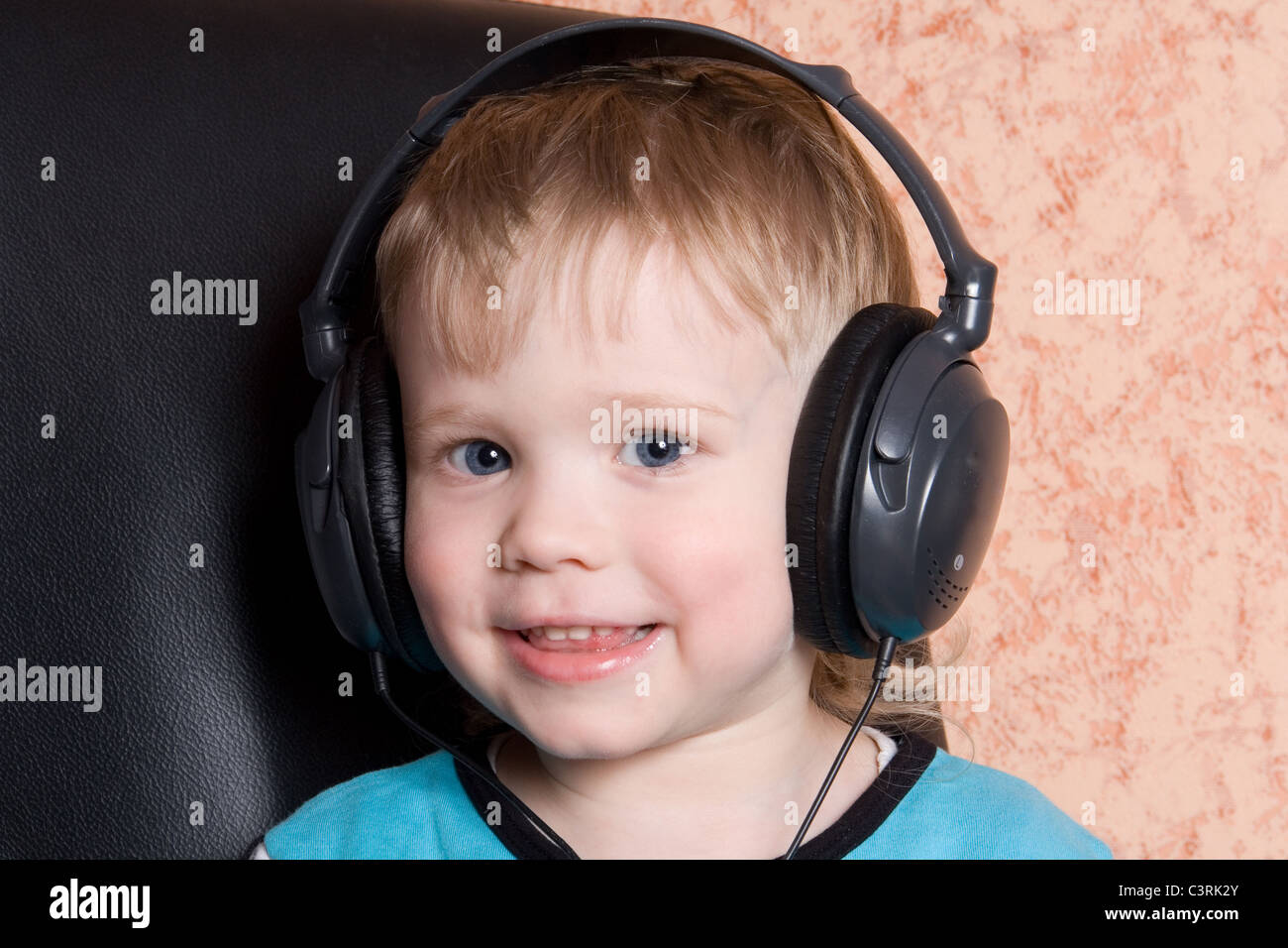 child in earphone listens music Stock Photo - Alamy