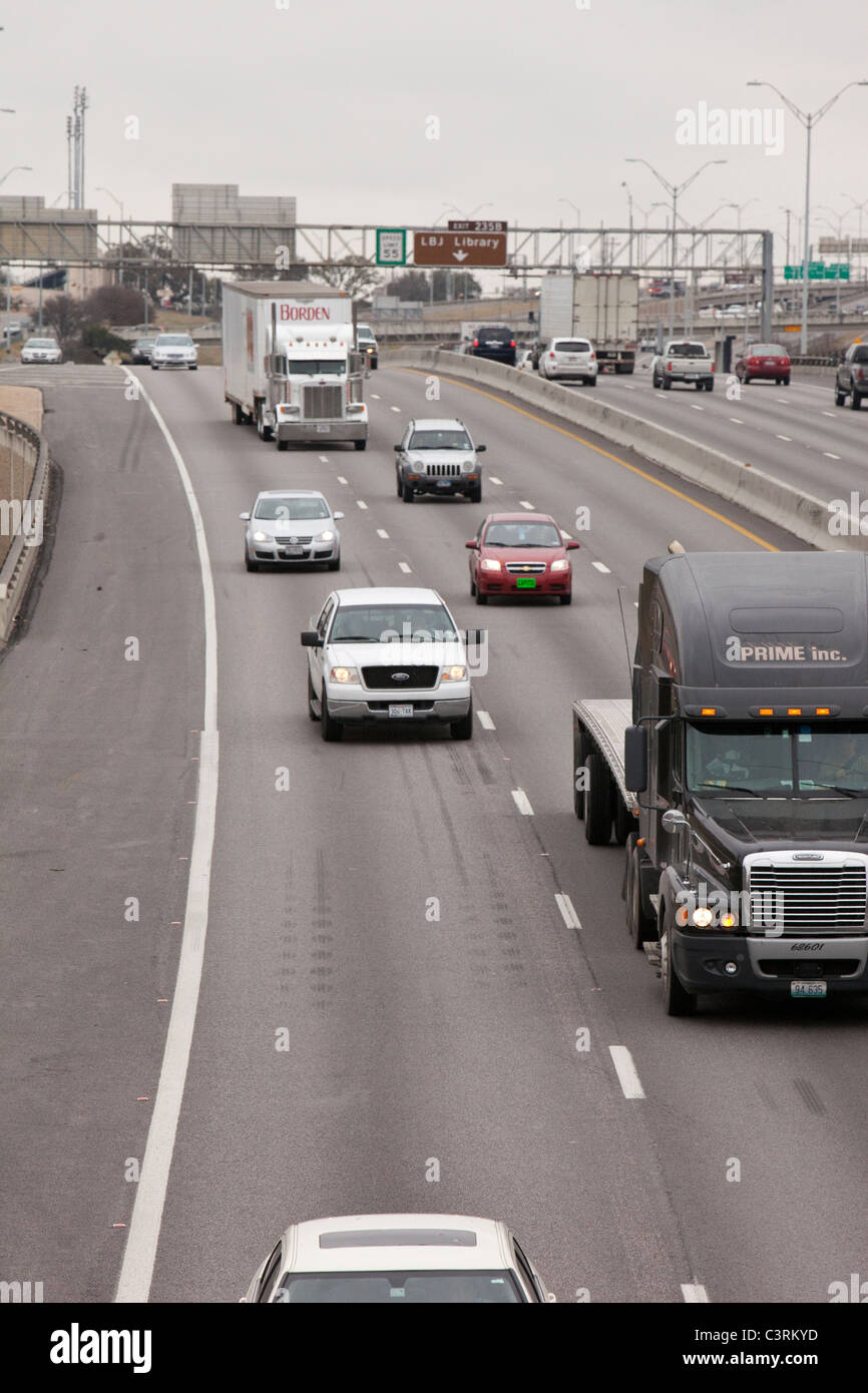 Truck and car traffic on Interstate 35 through downtown Austin Texas ...