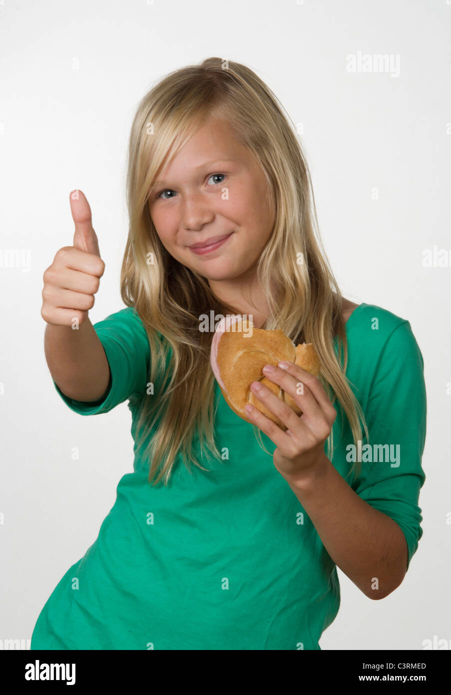 Girl 12 13 years with sandwich smiling hi-res stock photography and ...