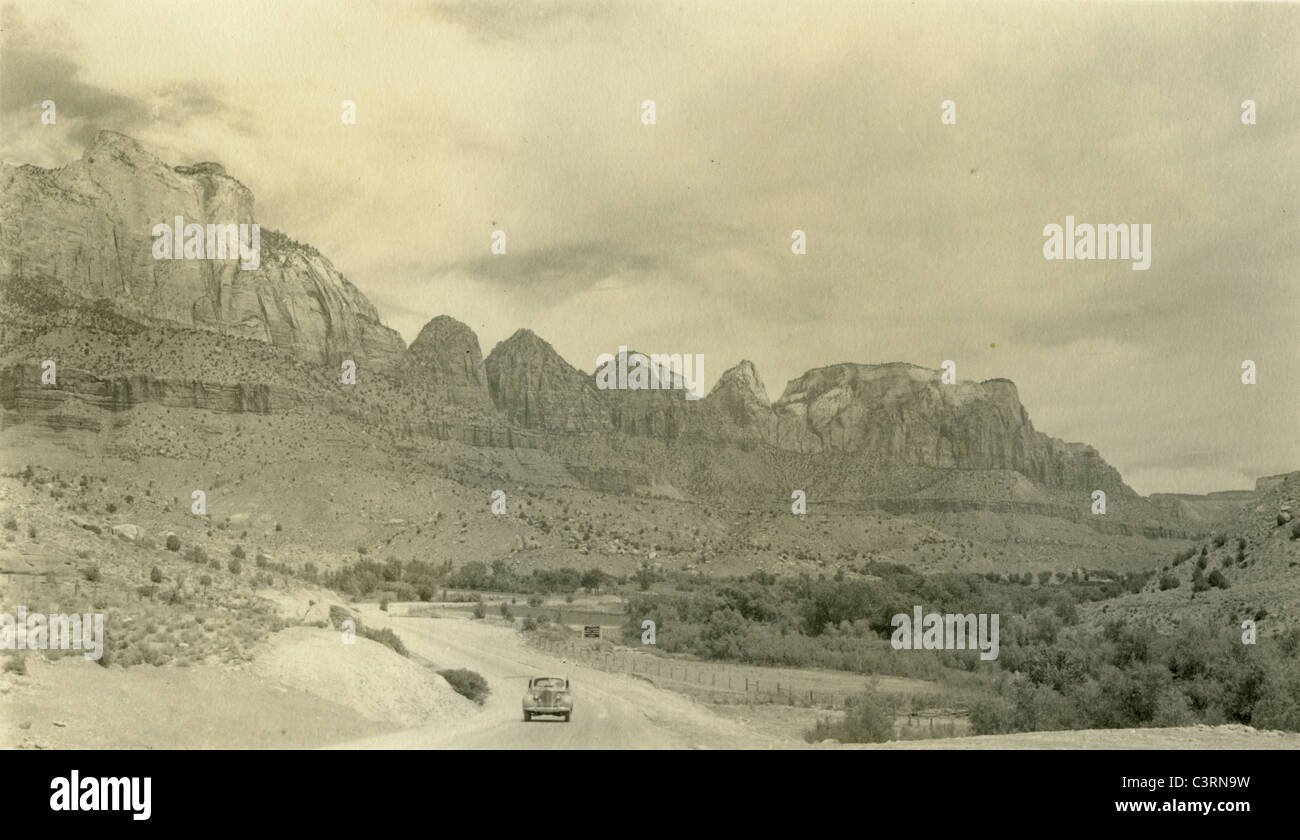 car driving through landscape of Zion National Park July 7, 1940 desert ...