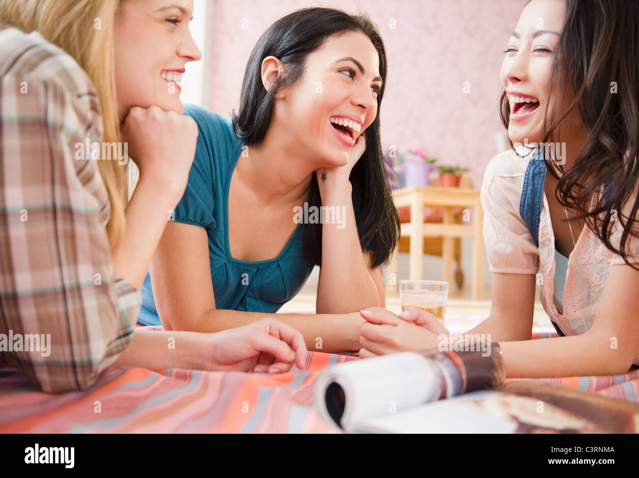 Friends socializing together Stock Photo - Alamy