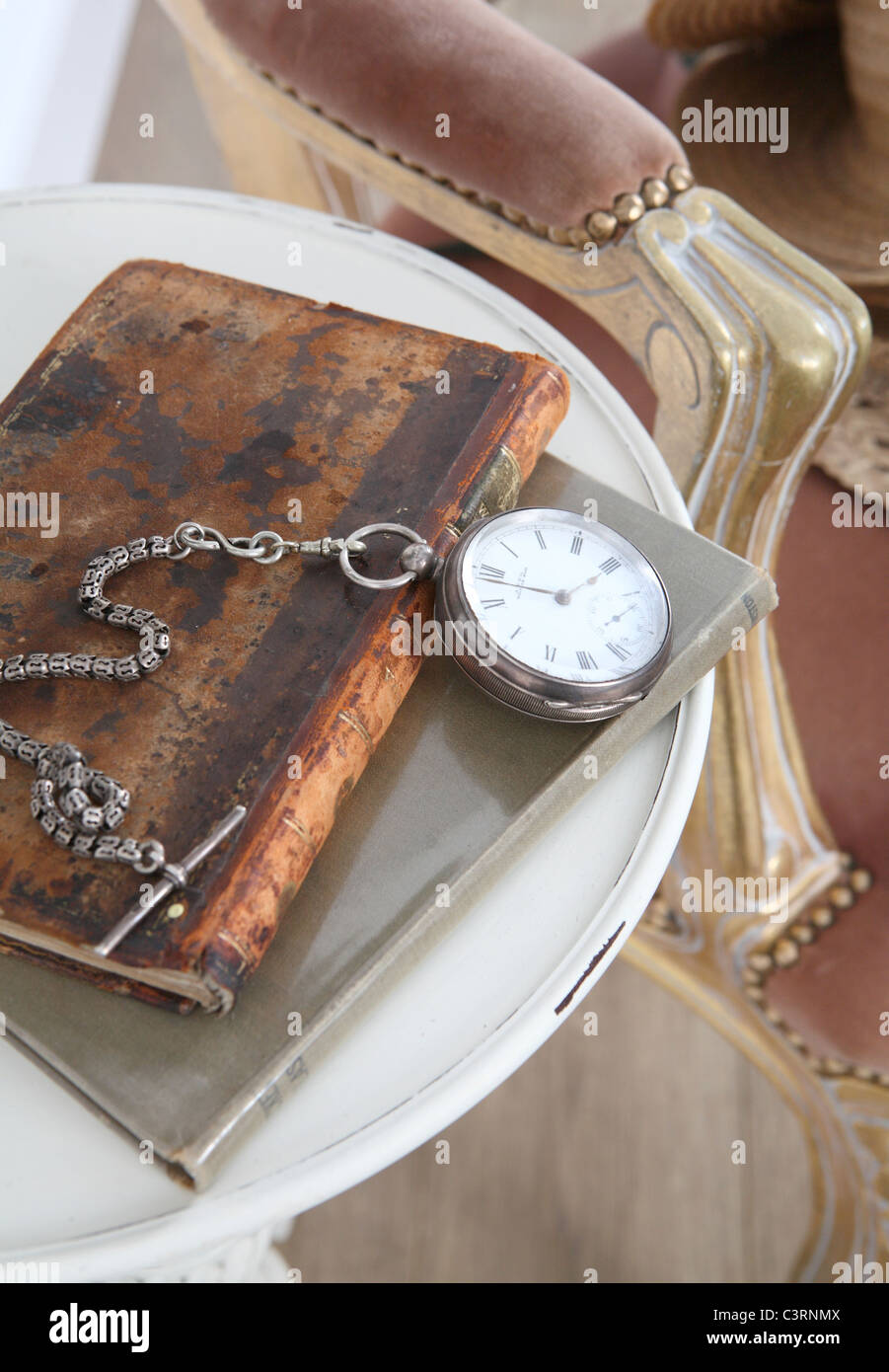 Old fob watch on old book Stock Photo - Alamy