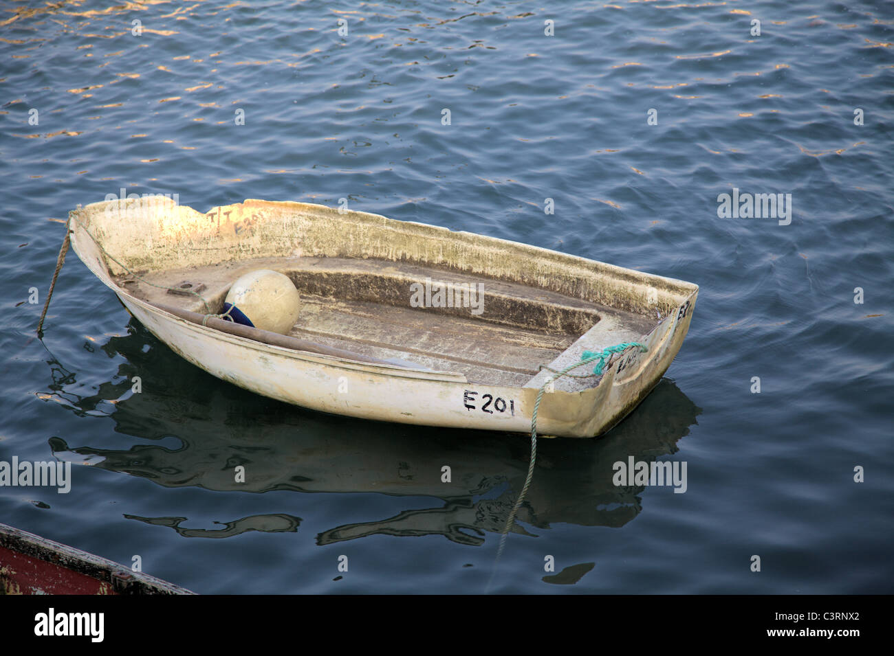 Small boat afloat Stock Photo - Alamy
