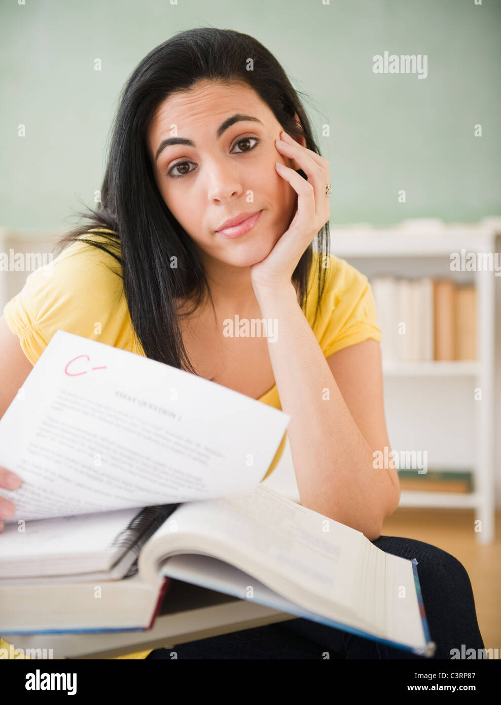Hispanic woman studying in classroom Stock Photo - Alamy