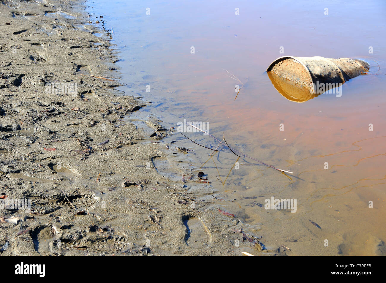 Rusty Barrel Pollutes River Stock Photo - Alamy