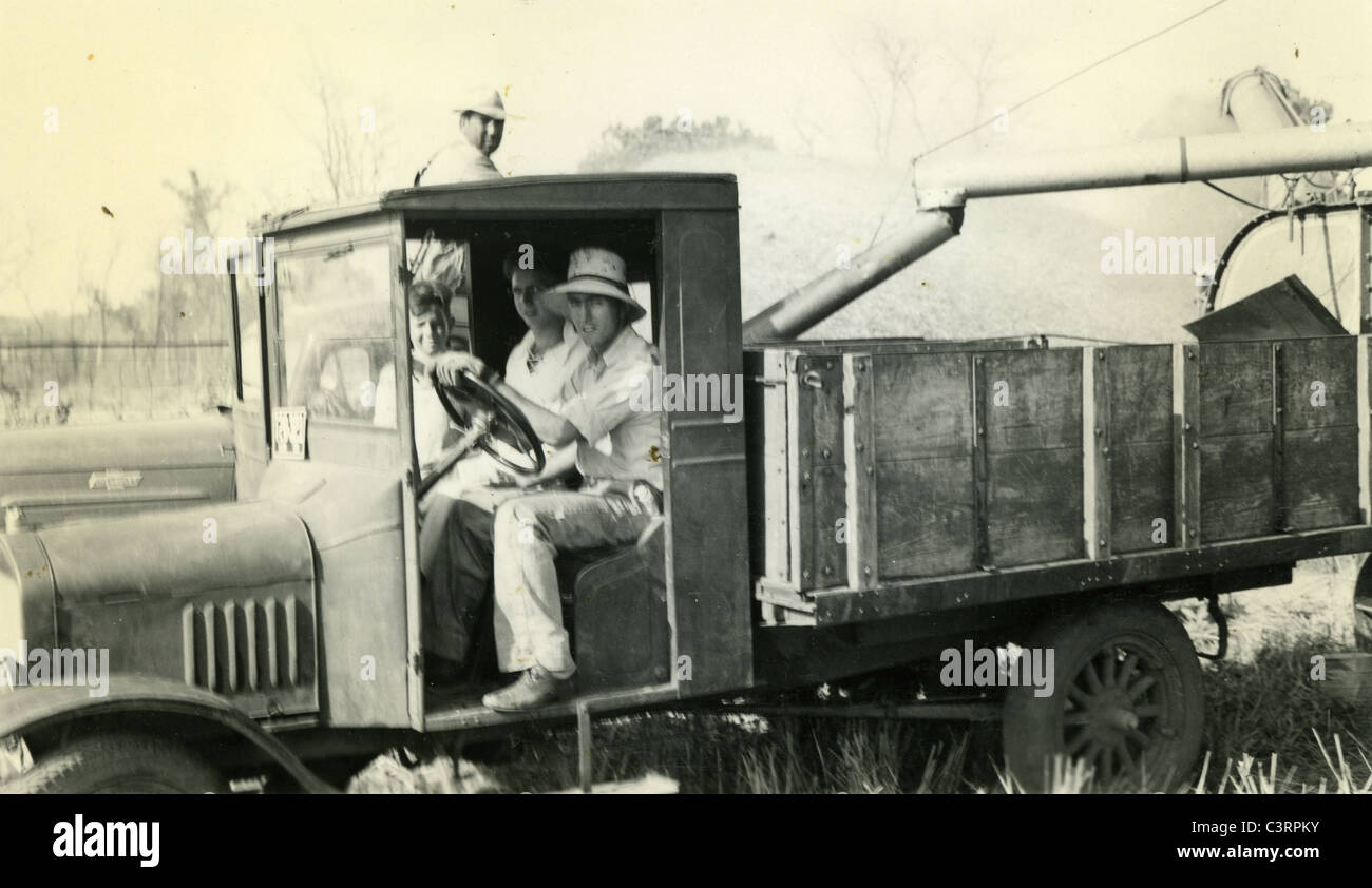 Farm laborers sit in a truck during harvest of grains 1930s truck labor ...