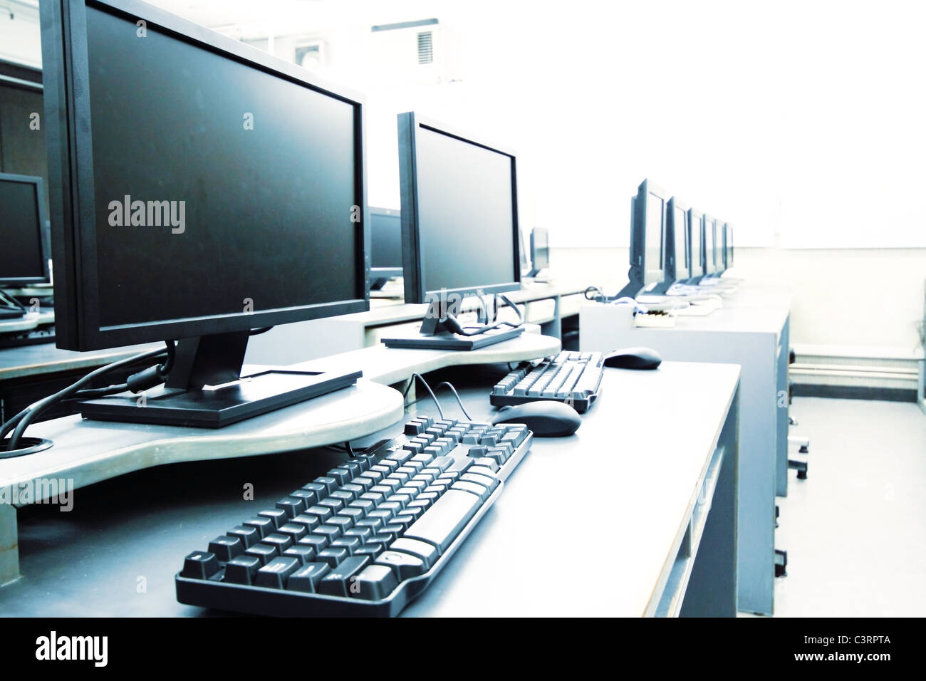 workplace room with computers in row Stock Photo - Alamy