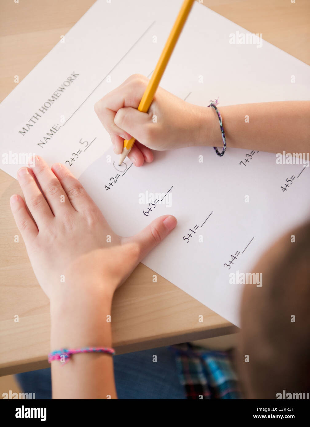 African American girl working on arithmetic homework Stock Photo - Alamy