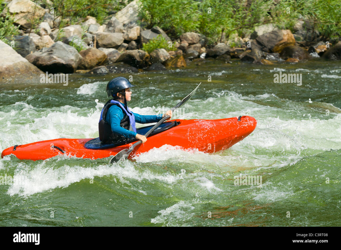 Caucasian girl kayaking in river Stock Photo - Alamy