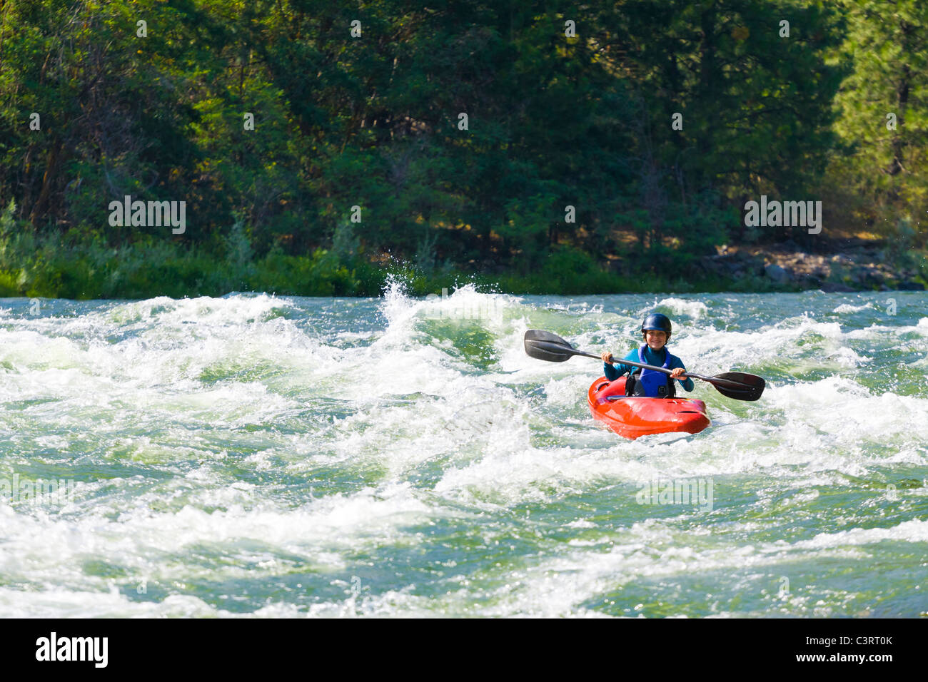 Caucasian girl kayaking in river Stock Photo - Alamy