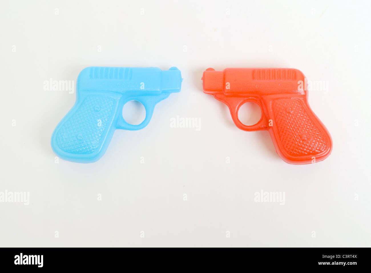 Stalemate Toy plastic guns pistols red blue colours metaphor war ...
