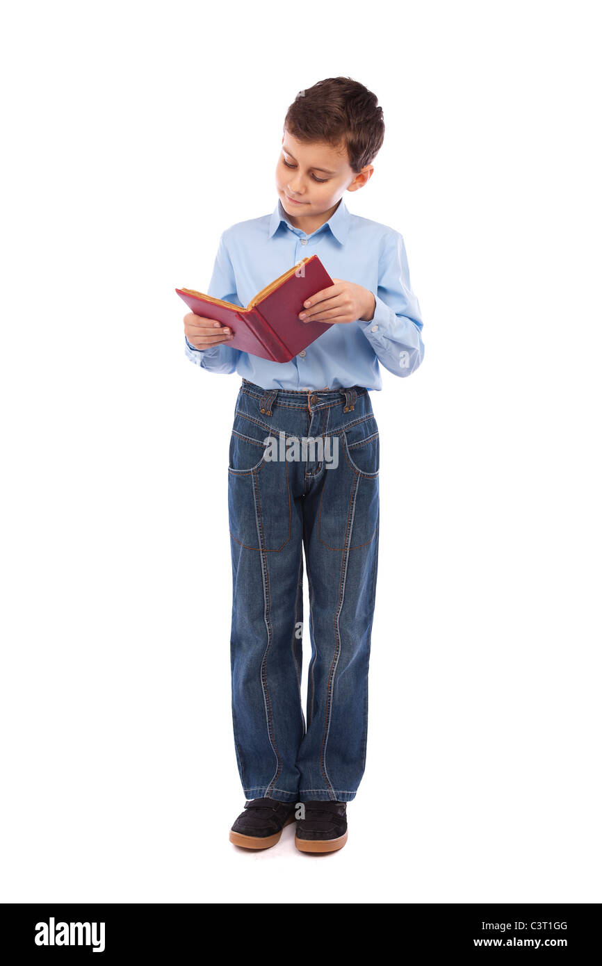Full length portrait of a schoolboy reading a book Stock Photo - Alamy