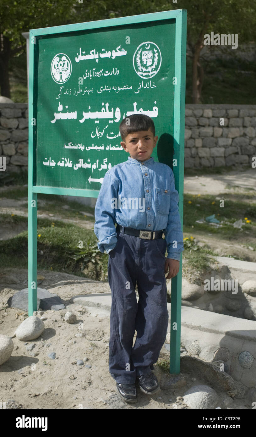 A boy stand next to a sign Stock Photo - Alamy