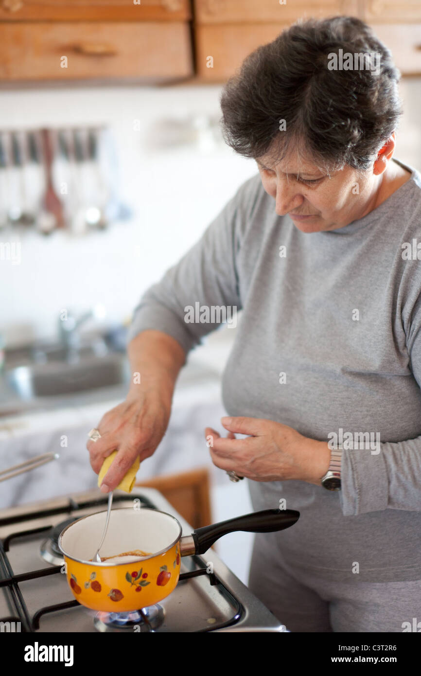 Senior person cooking on gas stove hi-res stock photography and images ...