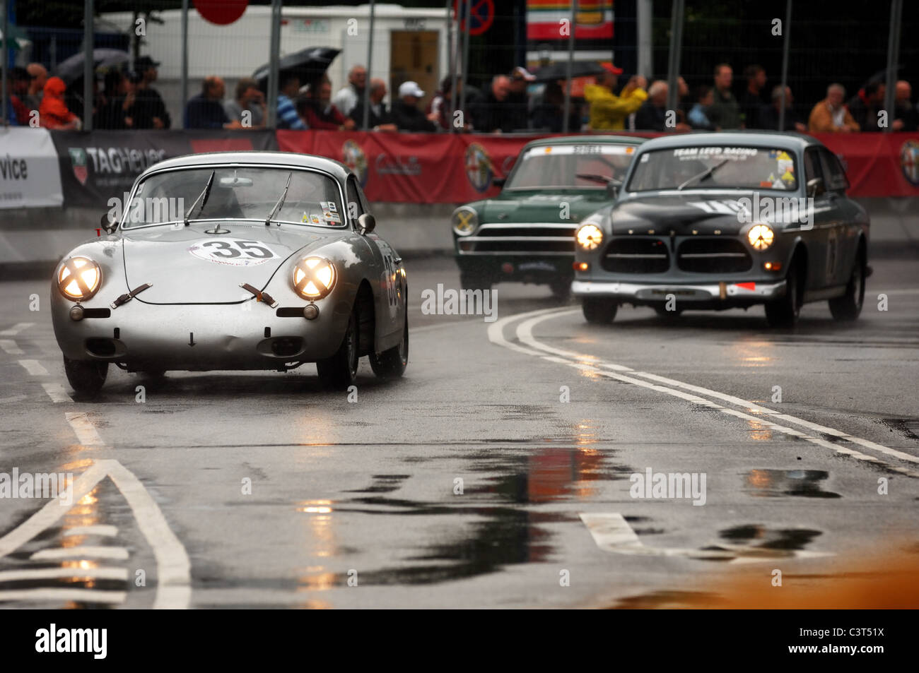 Car race on the streets of Copenhagen Denmark during very wet weather ...