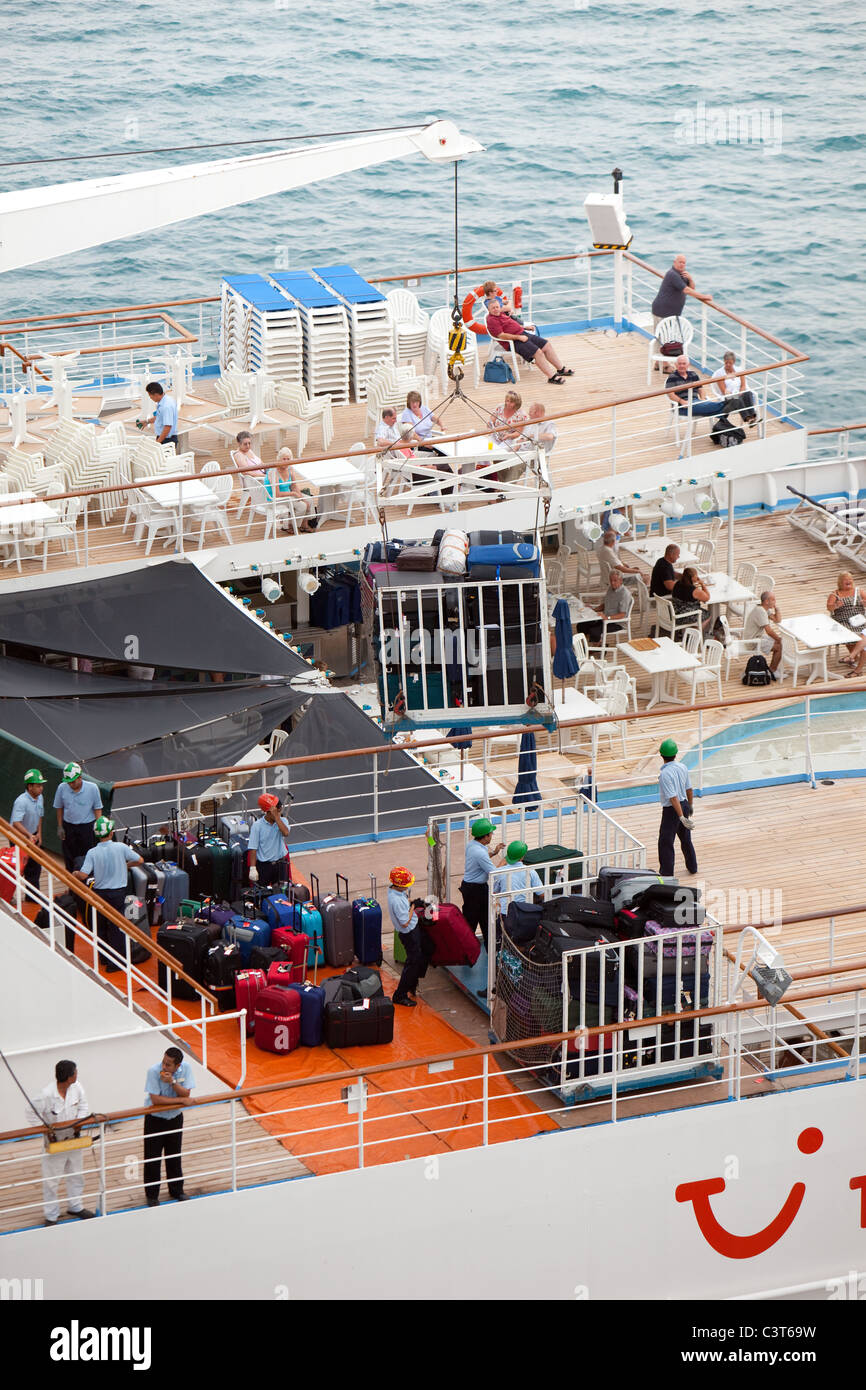Unloading crates of luggage hi-res stock photography and images - Alamy