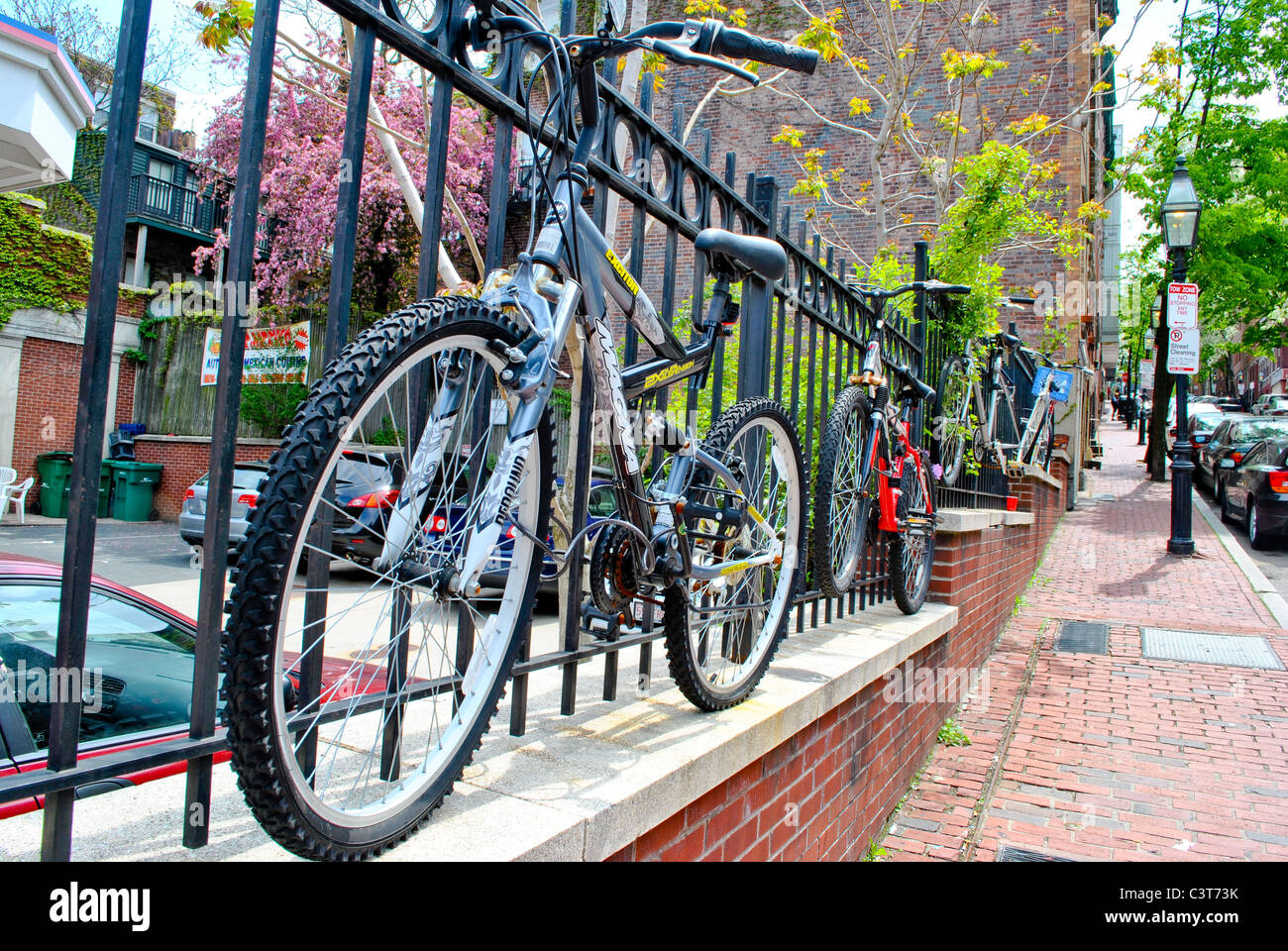 Bicycle on the fence Stock Photo - Alamy