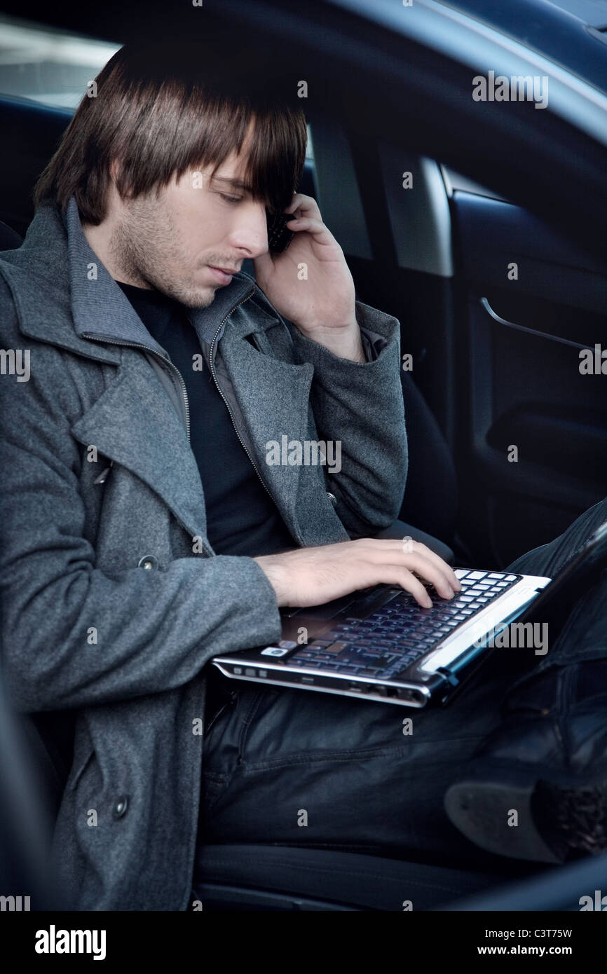Handsome man posing and working Stock Photo - Alamy